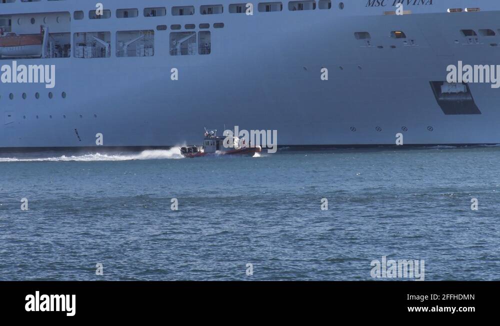 US Coast Guard machine gun armed escort patrol boat 1 60p Stock Video ...