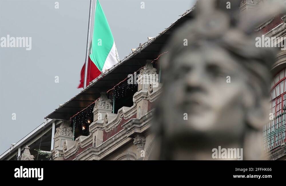 Moctezuma's statue, mexican flag waving. CLOSE UP-BLUR EFFECT-HANDHELD ...