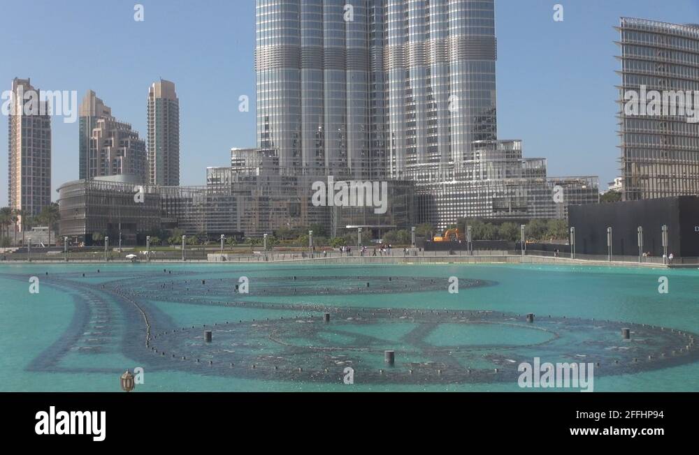 Burj Khalifa Lake Dubai fountain sunny day landmark tourism attraction ...