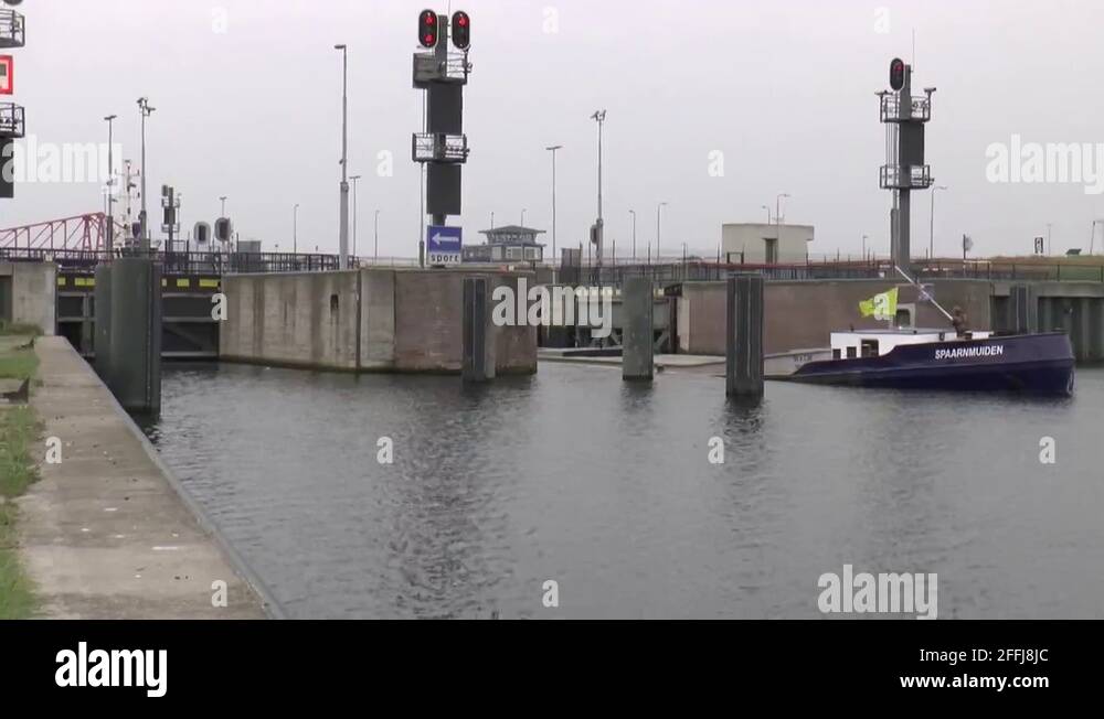 Ship passing the sluice gate Stock Video Footage - Alamy