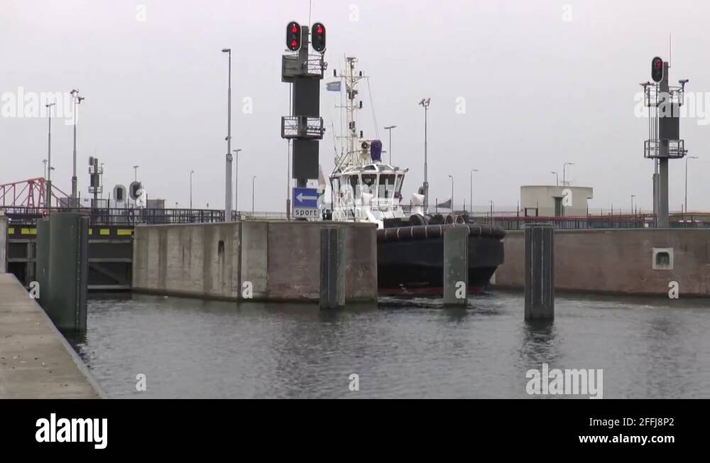Ship passing the sluice gate Stock Video Footage - Alamy
