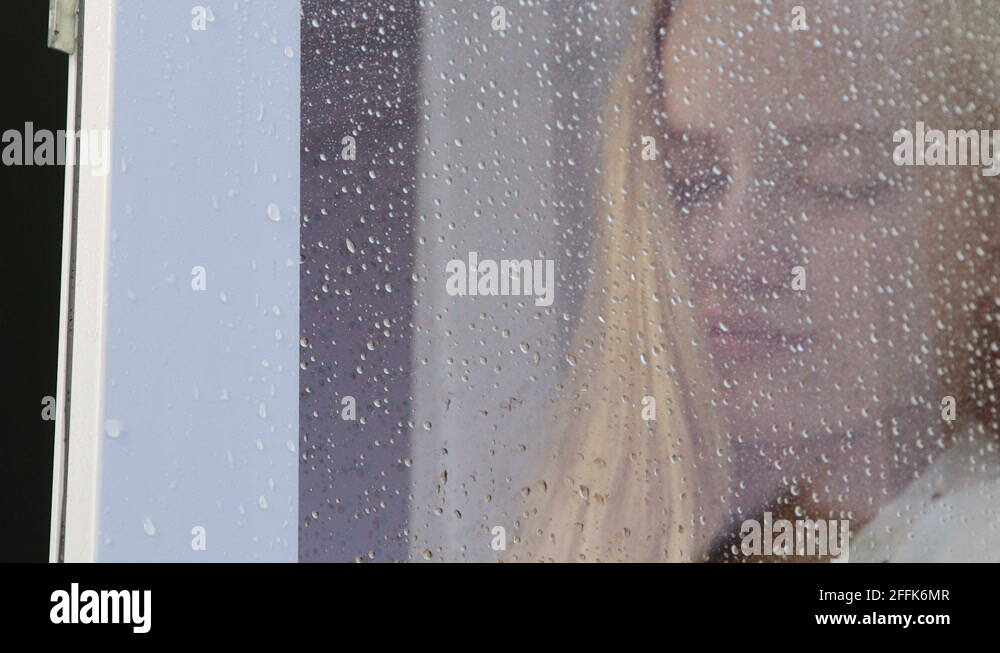 Girl looking out window sad rain Stock Videos & Footage - HD and 4K ...