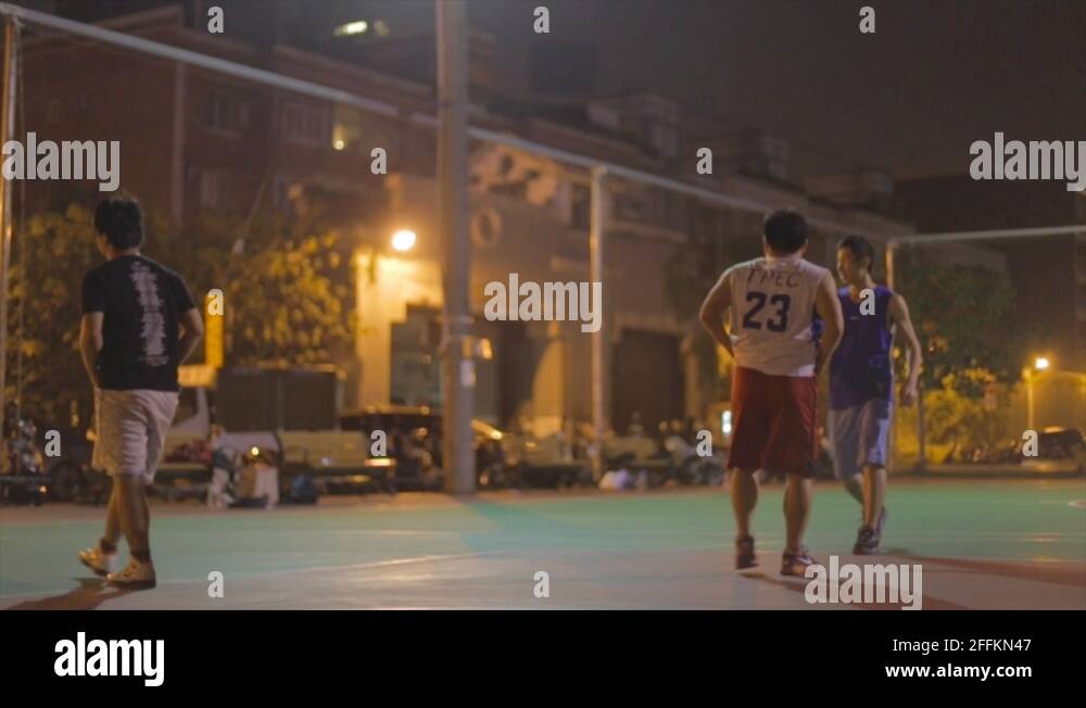 Taiwanese men play night basketball - under hoop angle Stock Video ...