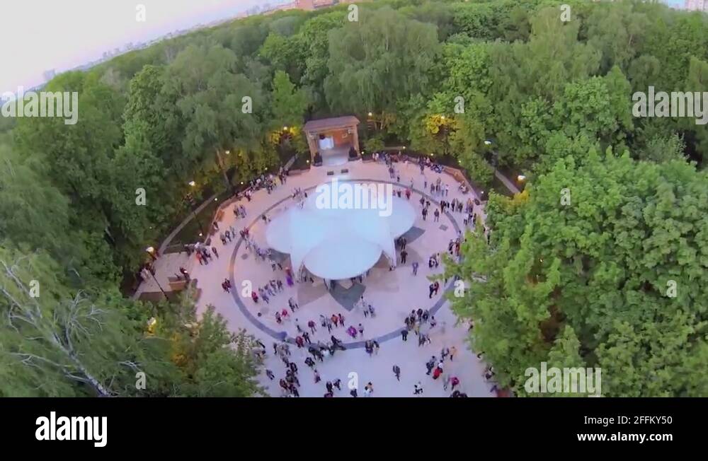 Lot of people walk out form dancing ground in Sokolniki park Stock ...