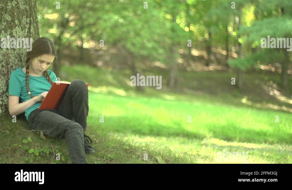 Tween girl reading Stock Videos & Footage - HD and 4K Video Clips - Alamy