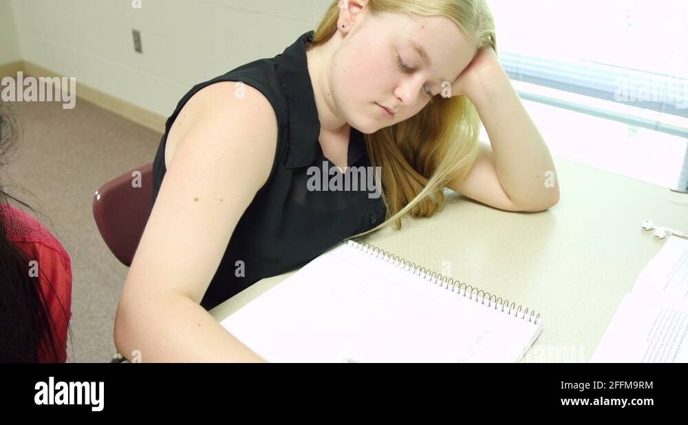 Students taking notes and doing their assignments in class. Ultra HD 4K ...