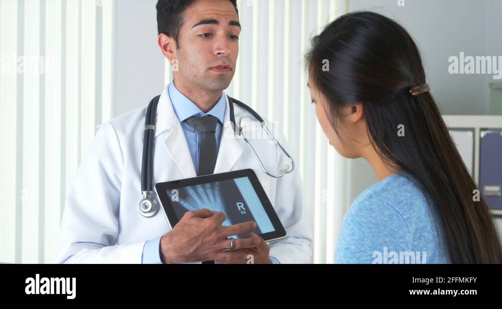 Mexican doctor talking with patient about hand xray Stock Video Footage ...