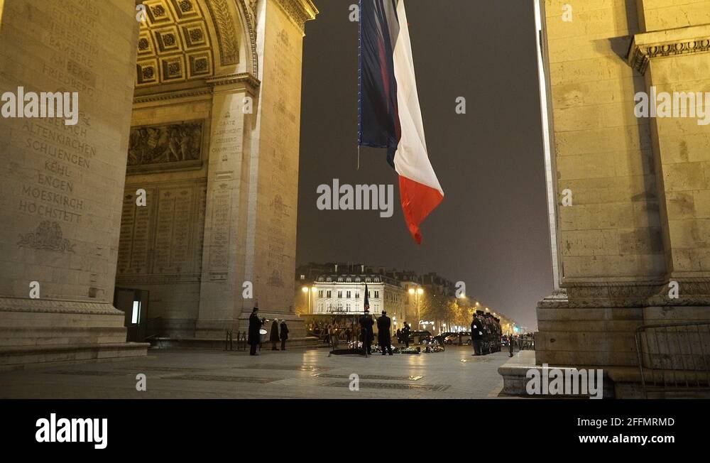 French flag hanging from Arc de triomphe in Paris Stock Video Footage ...