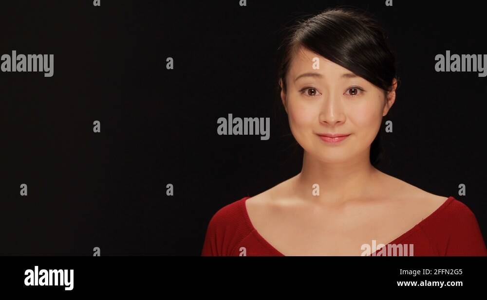 Young Asian woman surprised reaction face portrait, black background ...