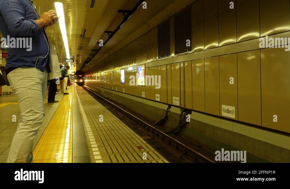Subway Train Enters the Station at Japan Metro Rail Station - Tokyo ...