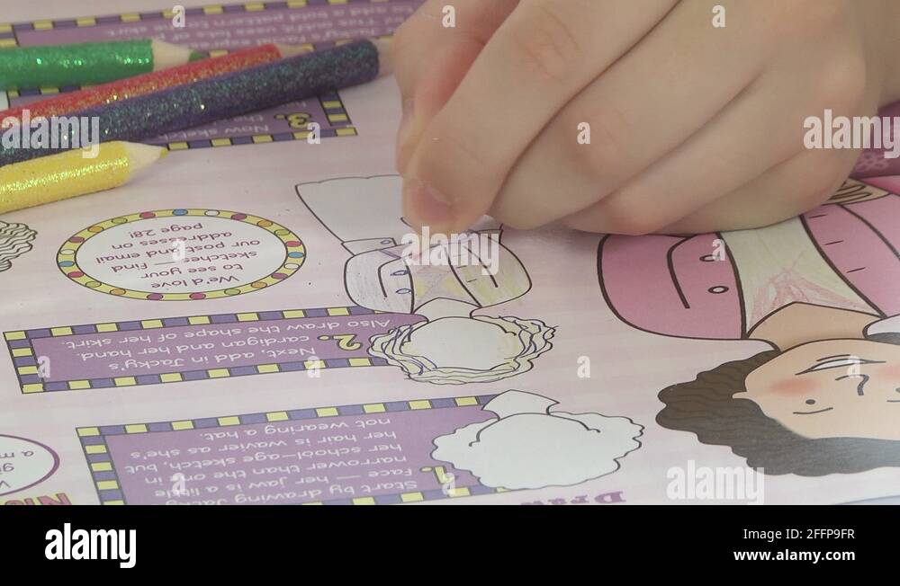 girl colouring in book Stock Video Footage - Alamy