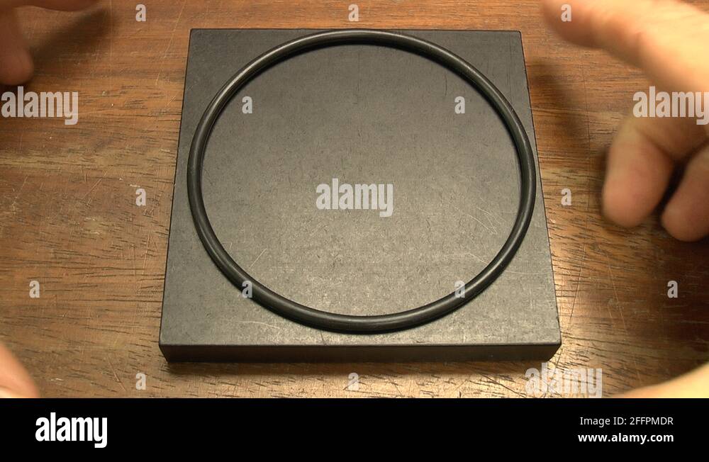 School science demonstration showing conduction using an ice cube Stock ...