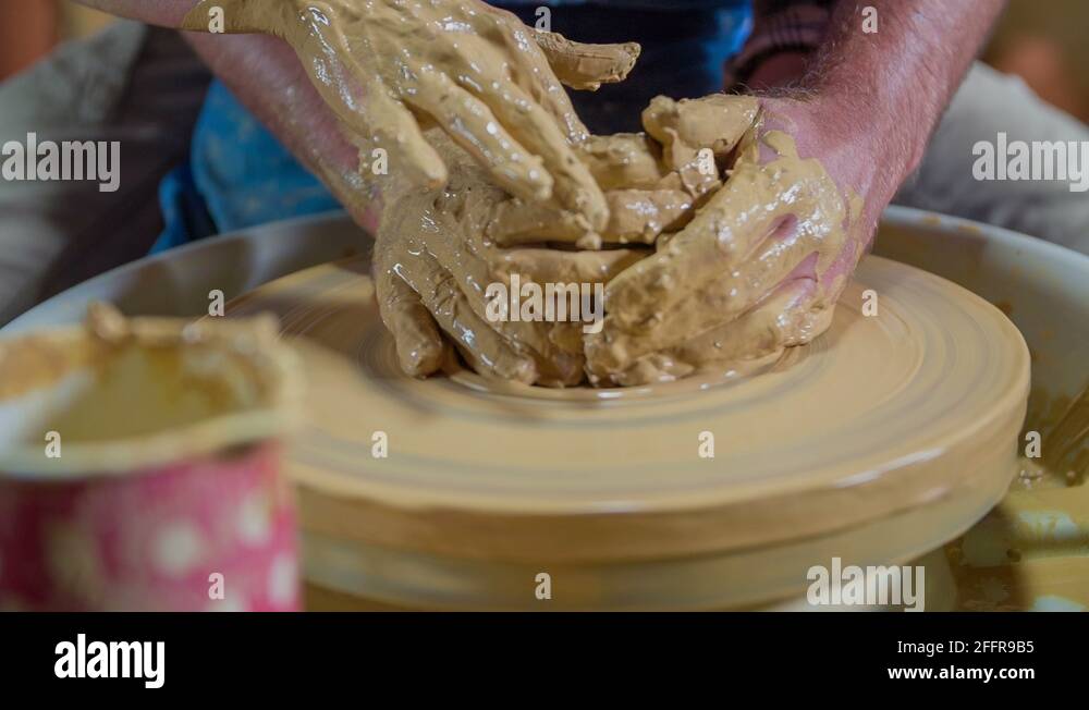 Forming the clay and adding water Stock Video Footage - Alamy