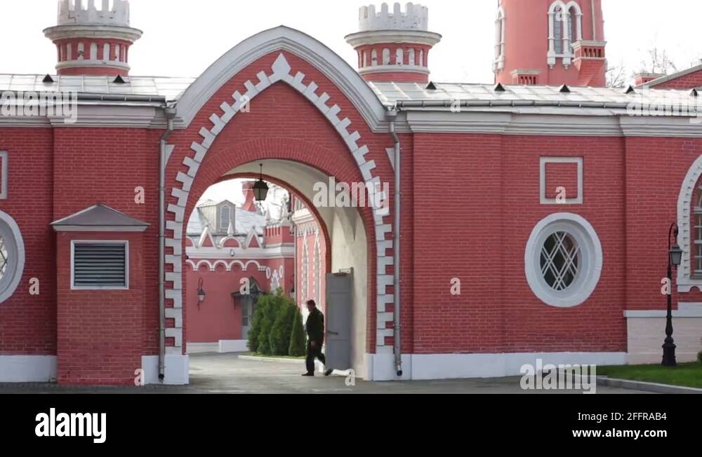Two people in arch of red brick Petroff Palace in Moscow Stock Video ...