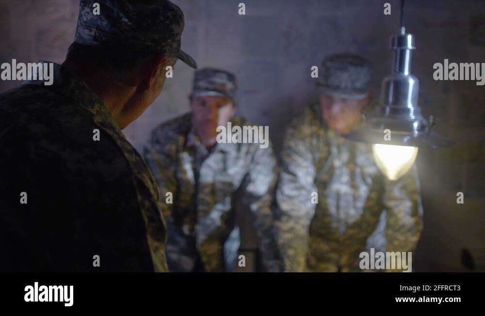 4K Military officers in army bunker, looking at map & discussing battle ... 4K Military officers in army bunker, looking at map & discussing battle ...