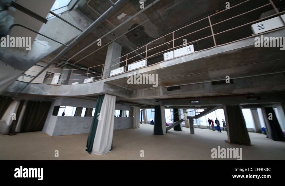 People in indoor observation deck with glass wall in building Stock ...