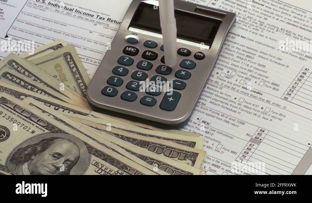 Calculating numbers income tax return Stock Videos & Footage - HD and ...