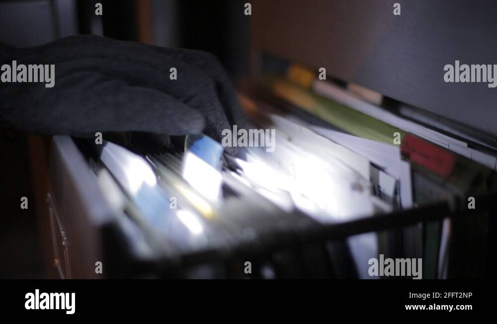 Burglar going through Filing Cabinet Stock Video Footage - Alamy