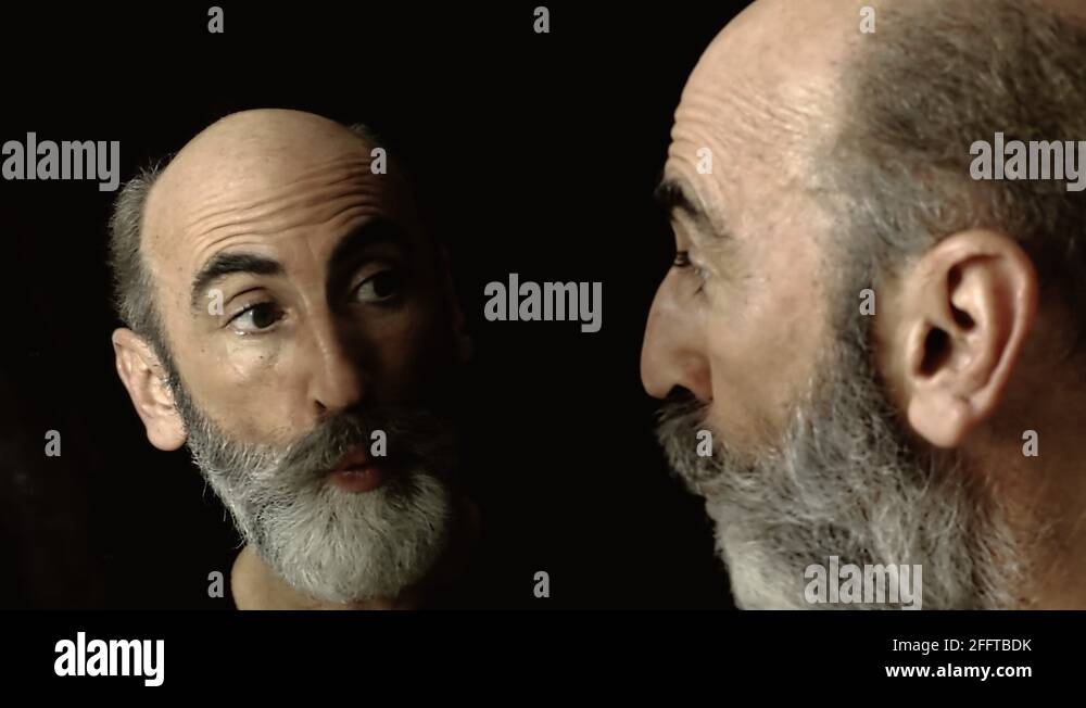 Bearded old man mirror smirk sneer faces Stock Video Footage - Alamy