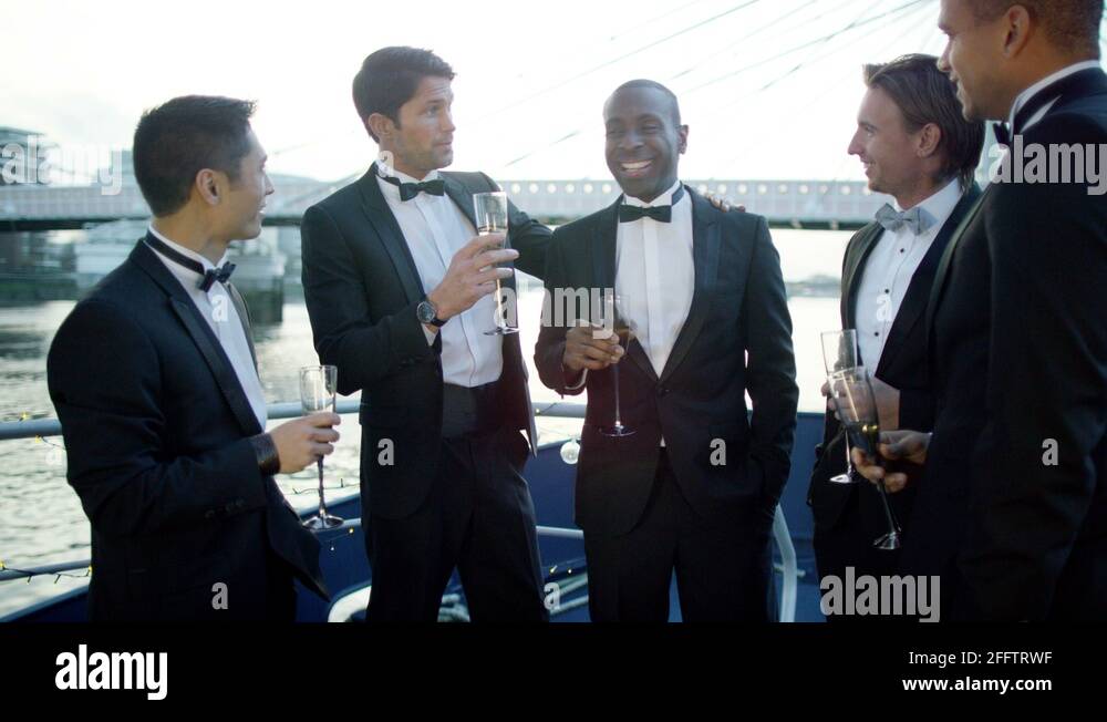 4K Male friends or business colleagues, chatting at formal social event ...
