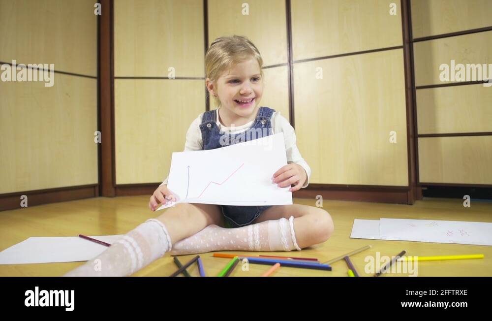 little girl is showing a graph on her drawing slow motion Stock Video ...