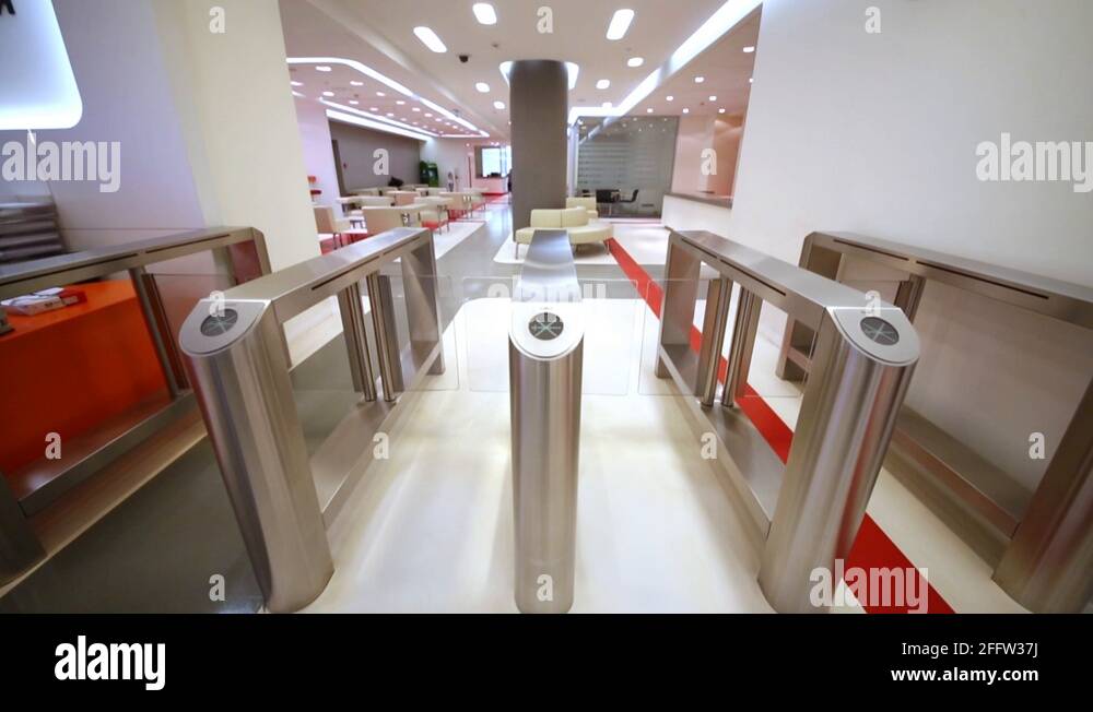 Entry gates from reception hall to waiting room Stock Video Footage - Alamy
