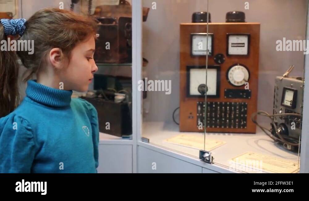 Girl stands next to old phones in Museum of phone in Preobrazhenskoe ...