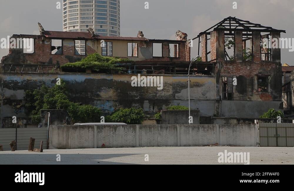 Two-Storey Ruined Building and Menara Komtar in Georgetown, Penang ...
