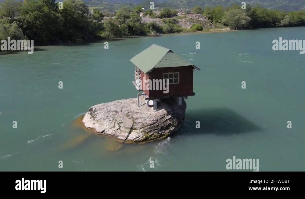 house built on the rock in the river Stock Video Footage - Alamy