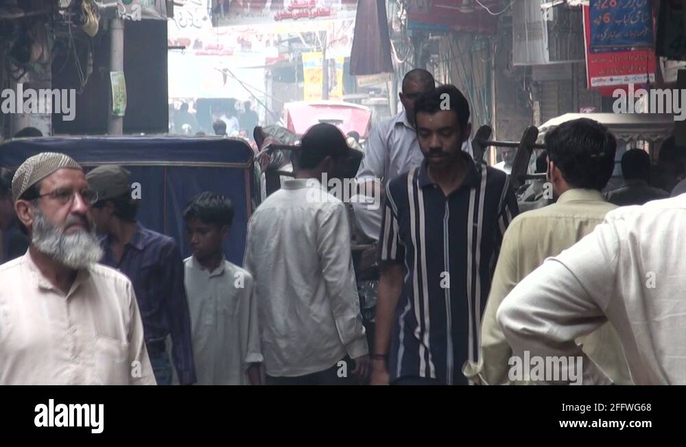 Pakistan, horse cart, people, walking through mysterious looking alley ...