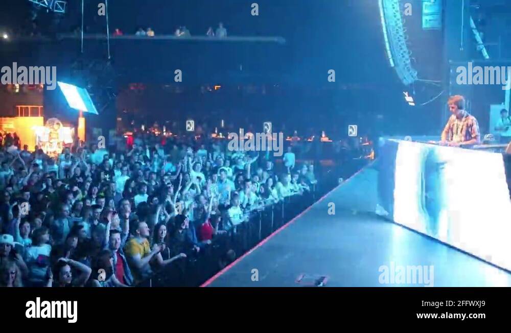 DJ performs and crowd dance in night club Stadium Live Stock Video ...