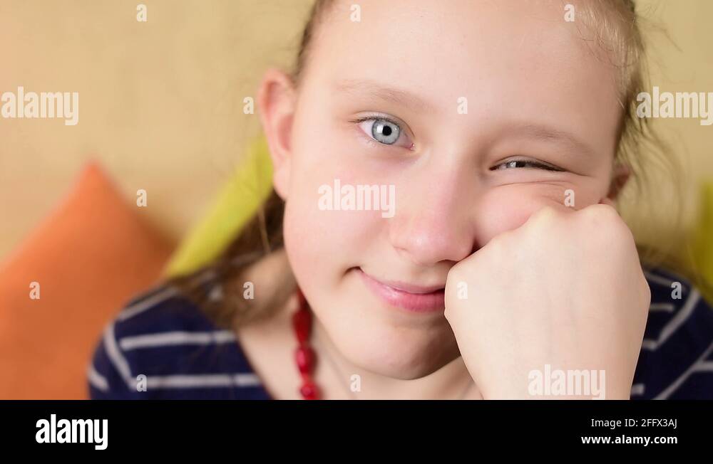 Teenage, big blue eyed blonde girl boring, facial expression, close up ...