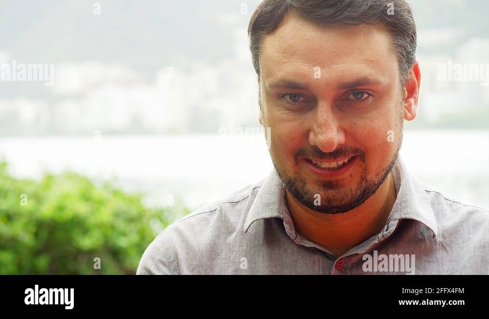 Brazilian man smiles at a cafe in Brazil Stock Video Footage - Alamy
