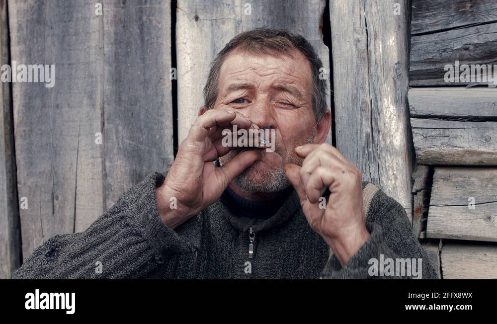 Poor old man smoking a homemade cigarette pathetic Stock Video Footage ...