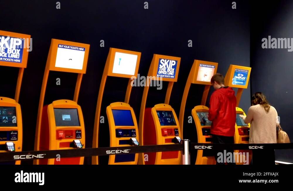 People buying movie ticket at cineplex Stock Video Footage - Alamy