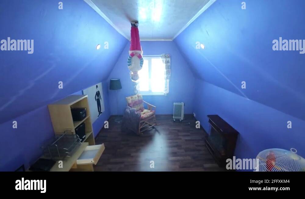 Little girl stands on ceiling upside down at inverted house Stock Video ...