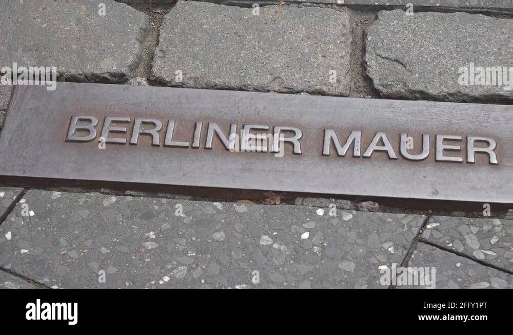 ULTRA HD 4K Pan right famous wall sign pavement Berlin downtown ...
