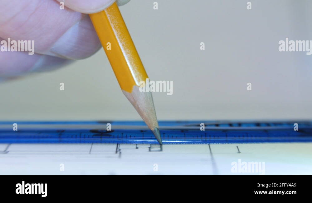 Drawing a pencil line on the ruler on the drawing sheet Stock Video ...