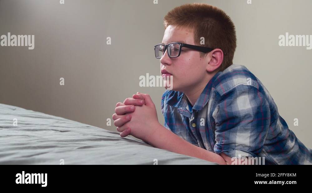Boy praying bed Stock Videos & Footage - HD and 4K Video Clips - Alamy