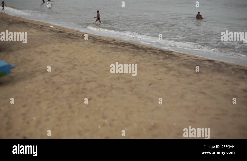 Indian children playing the ocean, long shot Stock Video Footage - Alamy