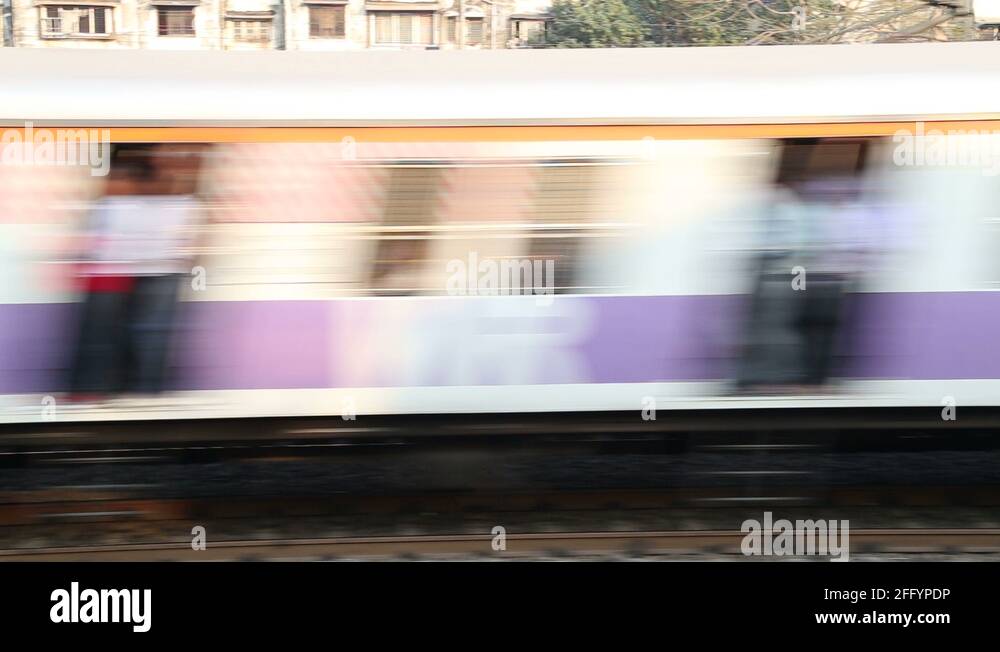 Two trains passing each other during departure in Mumbai Stock Video Footage - Alamy