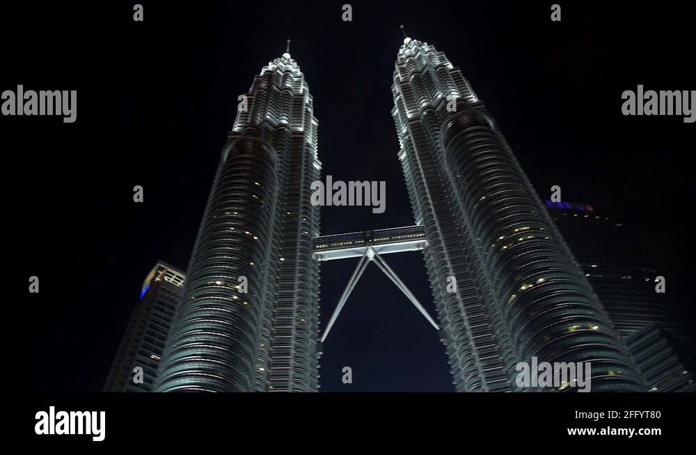 Illuminated twin towers of the petronas twin towers at night Stock ...