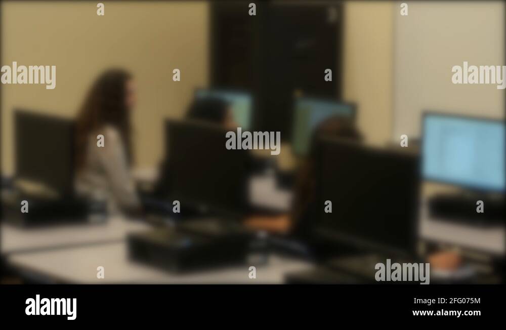 A teacher teaching in the computer lab at a university Stock Video ...
