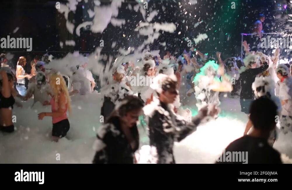 People in the foam dancing at the foam party Stock Video Footage - Alamy