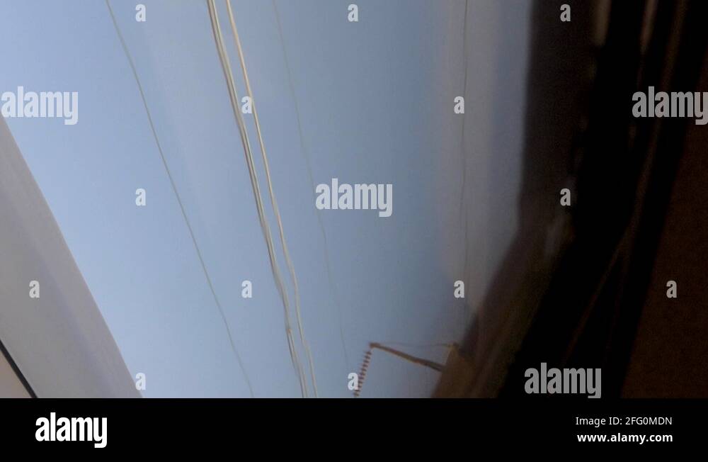 AmtrakTrain overhead power lines, dutch angle, cu pov Stock Video ...