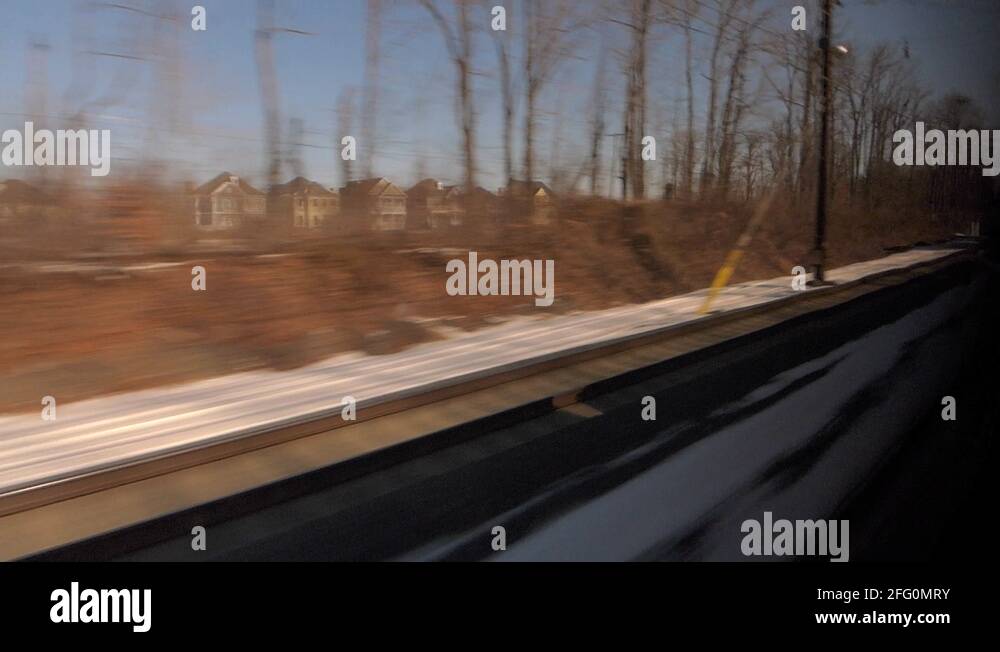 Amtrak Train pass freight train, fast Stock Video Footage - Alamy