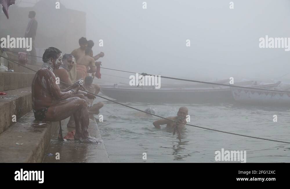 Indian men showering in Ganges river in Varanasi Stock Video Footage ...