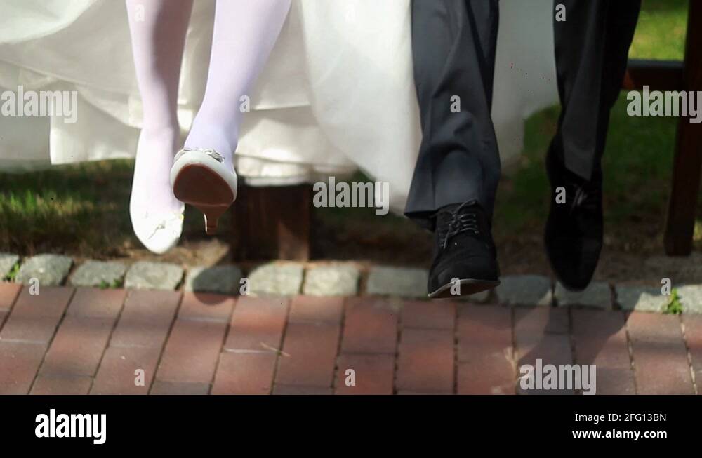 two couple, wife and husband and their legs Stock Video Footage - Alamy