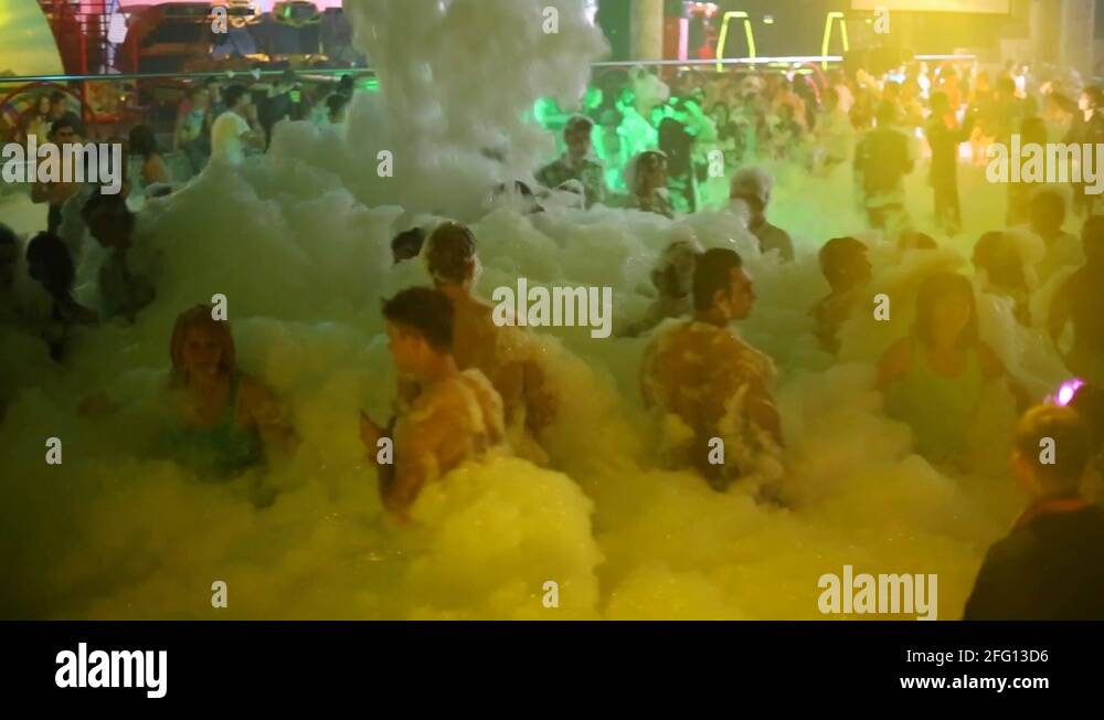 Youth having fun on the foam party in Tuning hall nightclub Stock Video ...