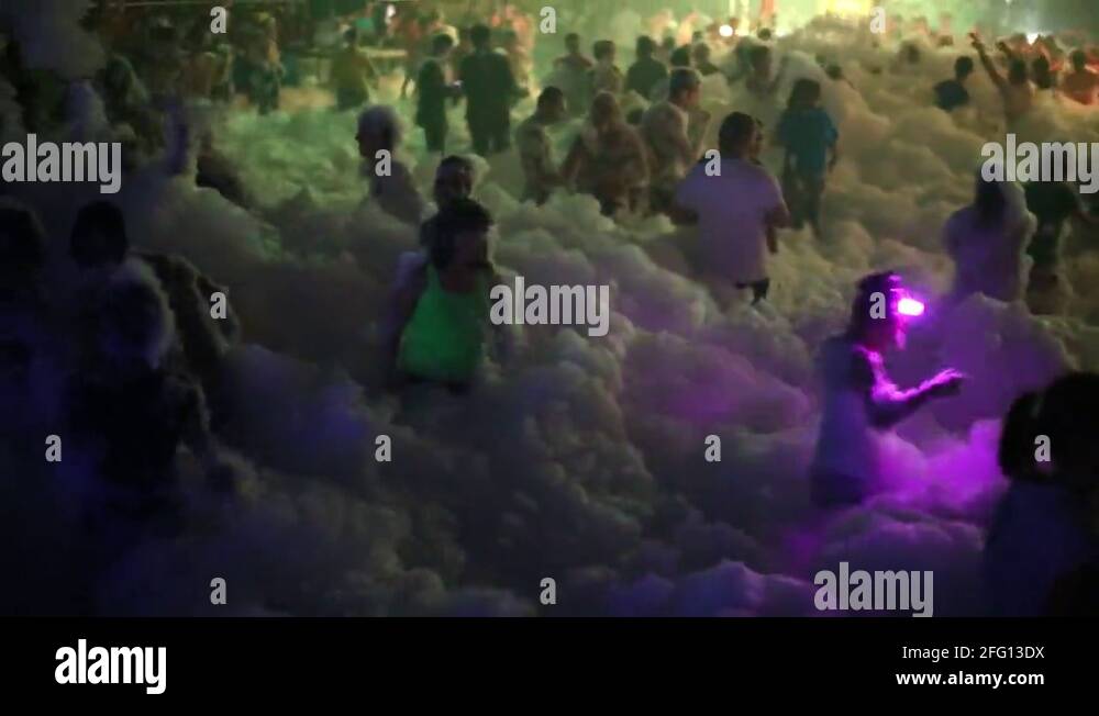 dance floor is filled with people and foam during the foam party Stock ...